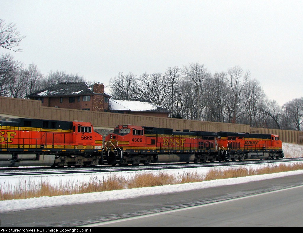 090303003 Pacing westbound BNSF manifest on newly-opened Hwy 12 "Bypass" following relocated ...